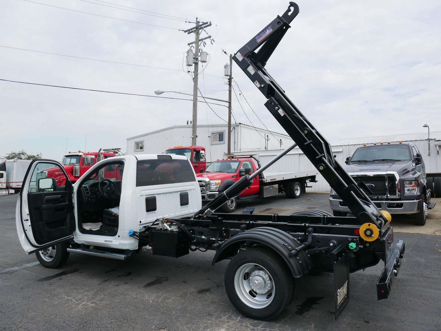 2023 Ram 5500 4x4 with a Stellar Flex 36-84-10 Hook lift body - Tipton ...